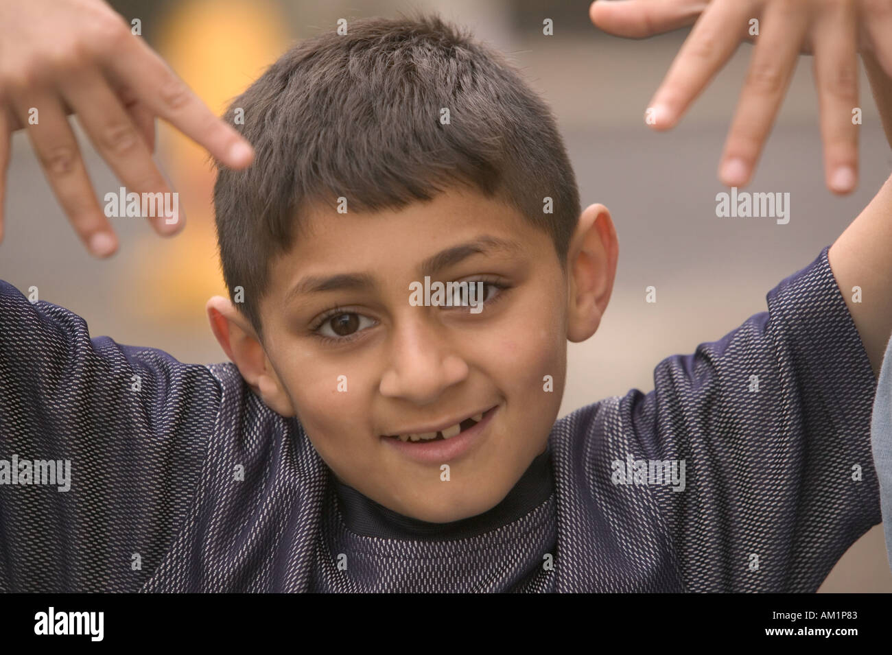 An asian child on the streets of burnley Lancashire Stock Photo - Alamy