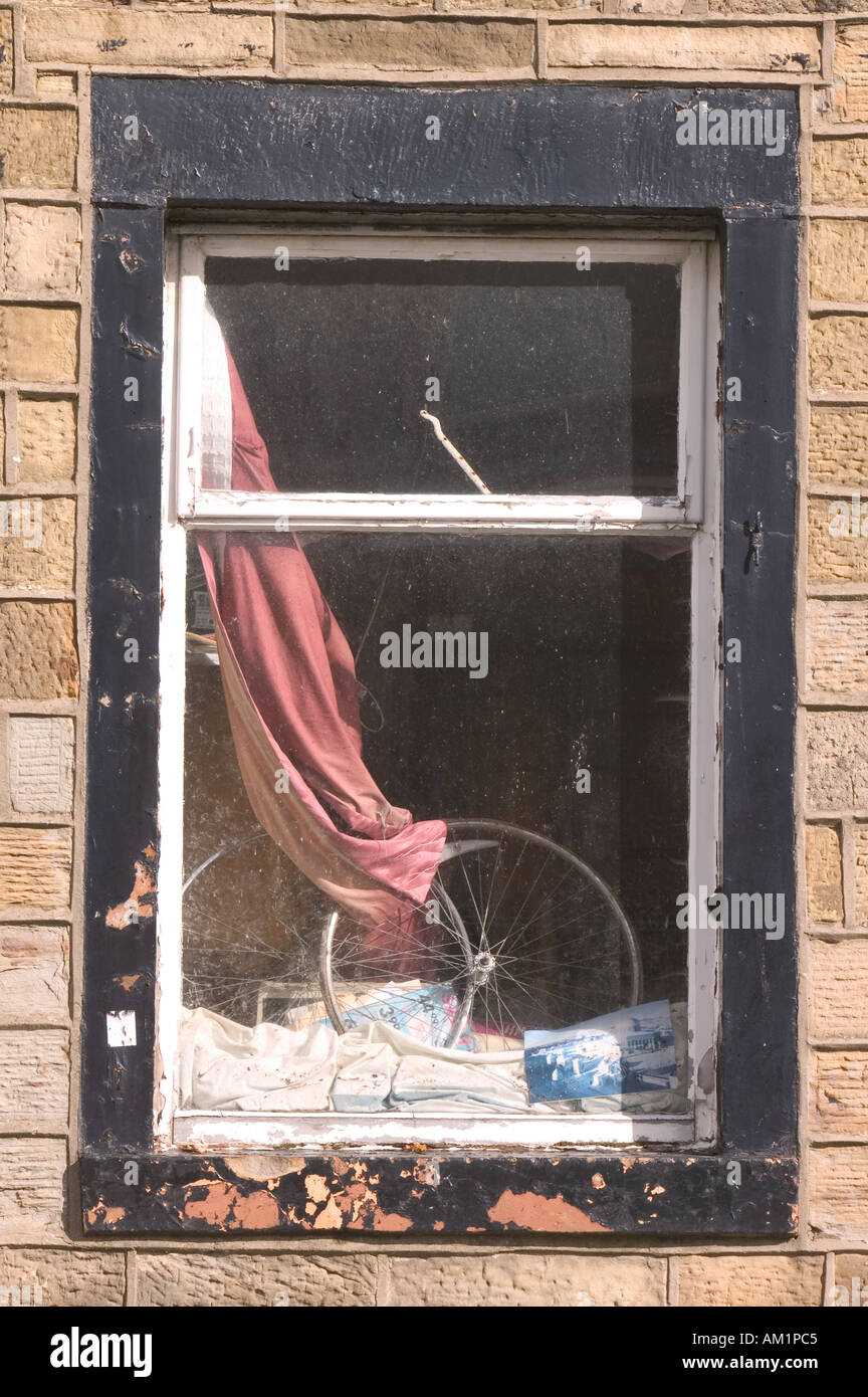 a window in a slum house in the Pakistani area of housing in Burnley ...