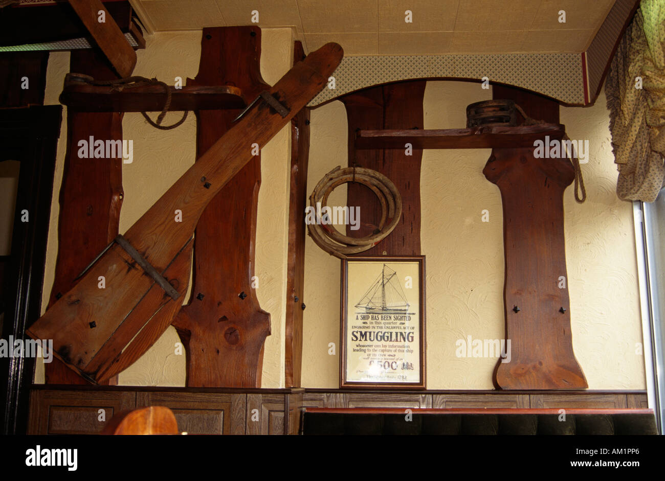 Wooden rudder from a boat displayed on a wall in a bar, Guernsey ...