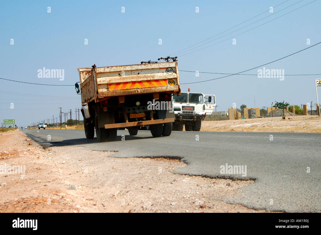 Road damage of an arterial road due to overloading of heavy trucks ...