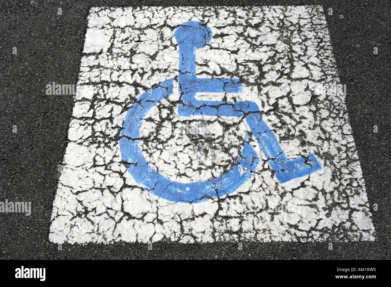 wheelchair symbol light blue cracked cracking disability floor road ...