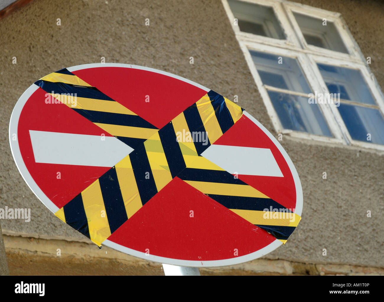 Taped over one-way street sign Stock Photo - Alamy