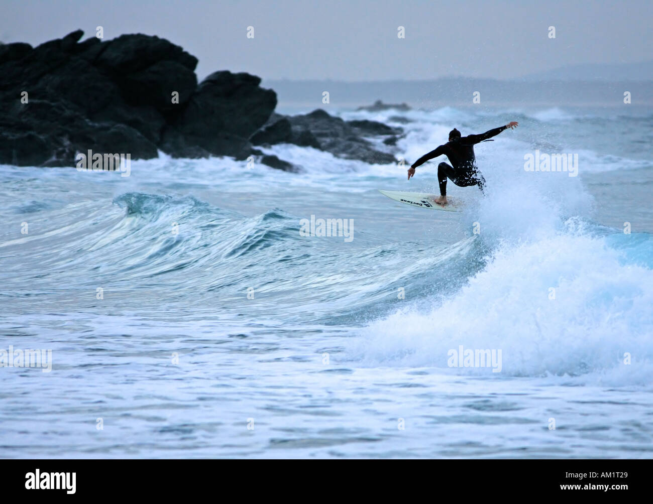 Surfer paddling out into the waves hi-res stock photography and images ...