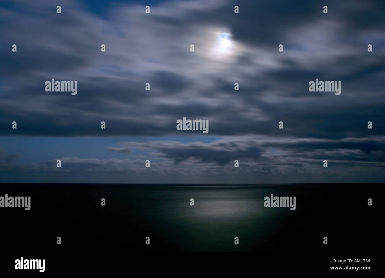 Moon over the Pacific ocean Stock Photo - Alamy