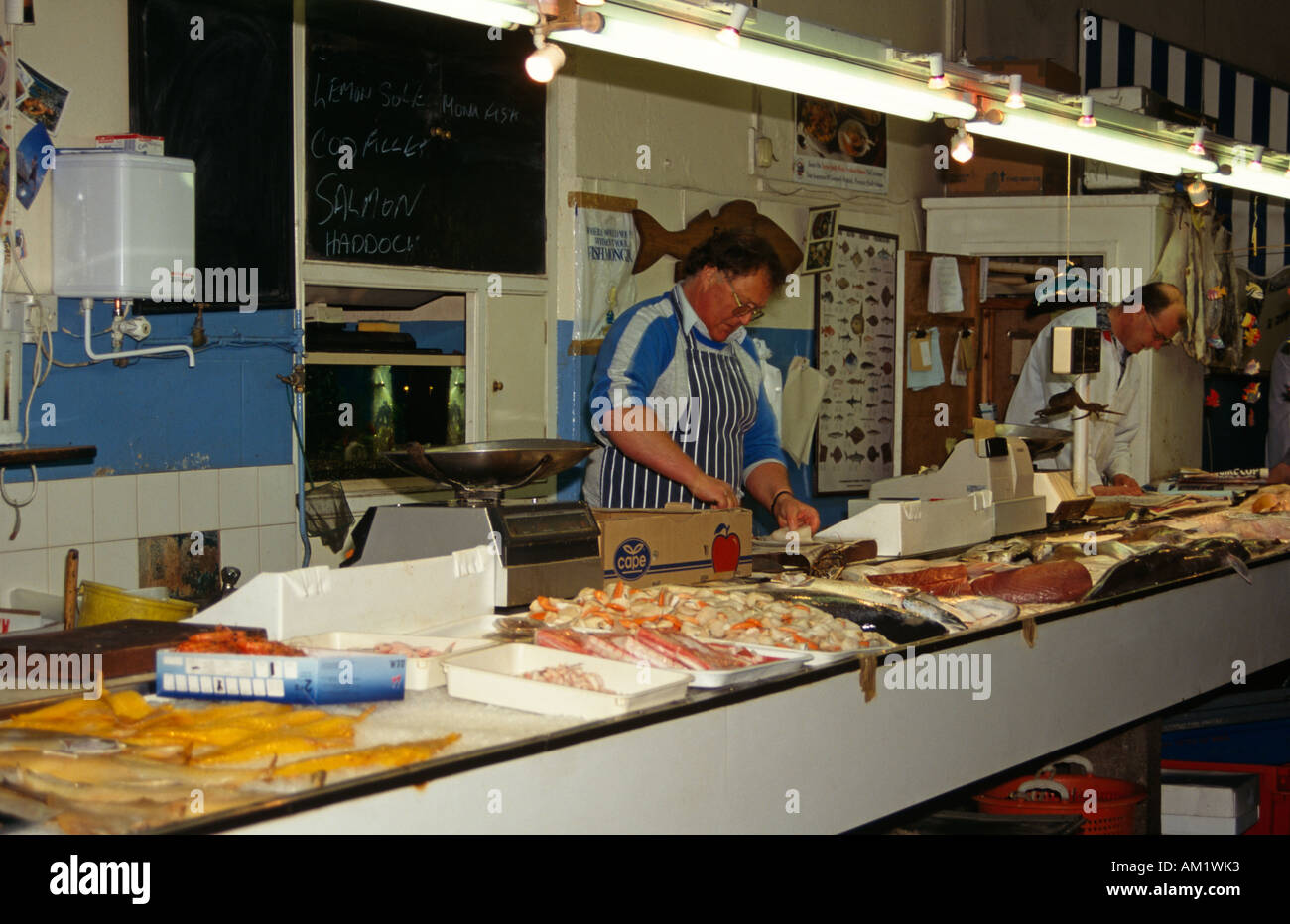 Fishmonger working in the Fish Market, St Peter Port, Guernsey, Channel ...