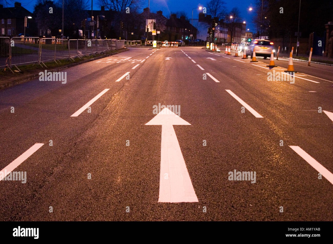 night road scene straight on arrow road markings Stock Photo - Alamy