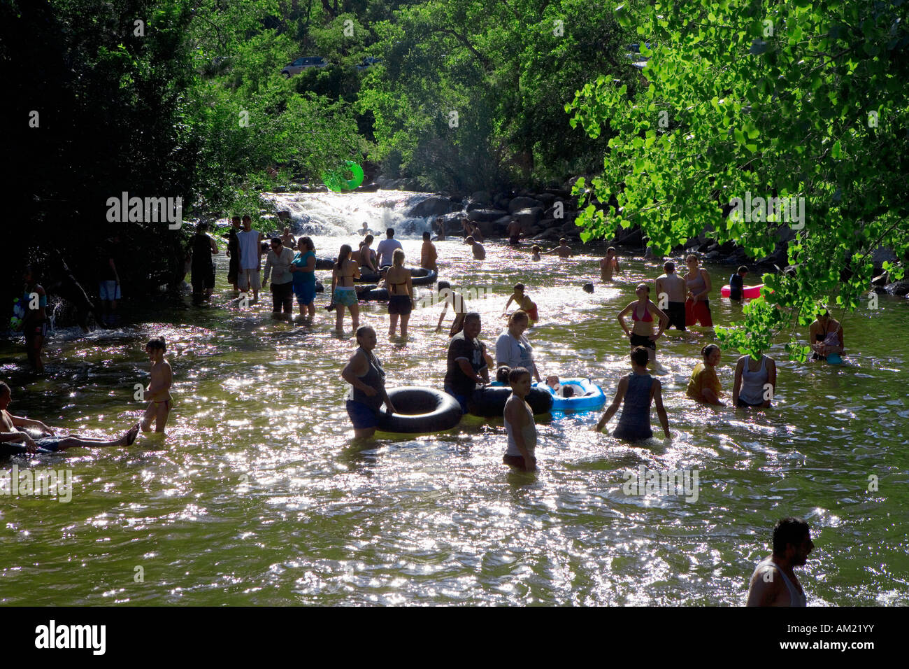 People playing in Boulder Creek on hot Summer day in Boulder, Colorado ...