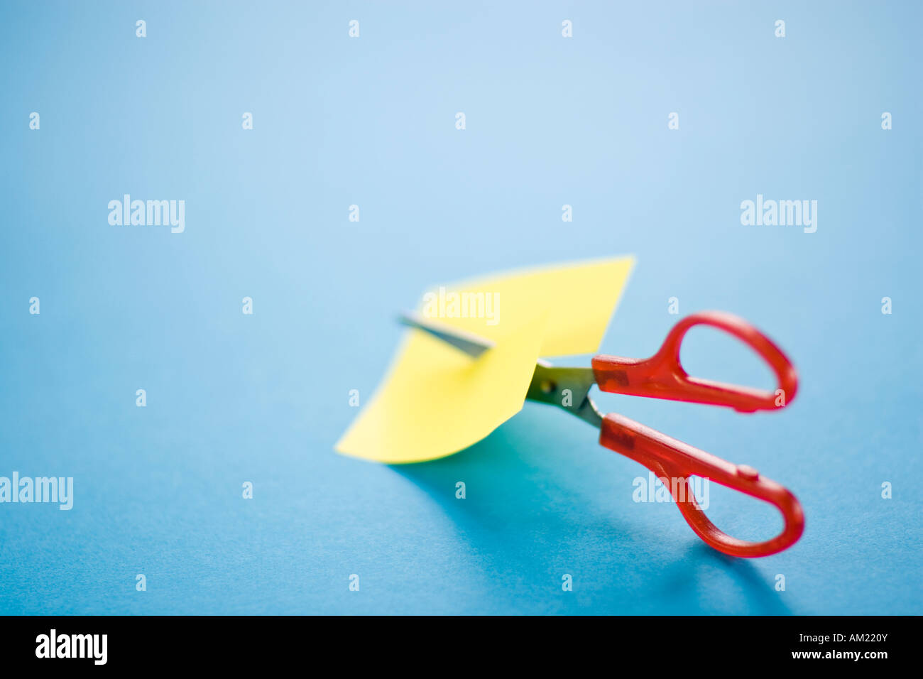 Cutting a paper Stock Photo - Alamy