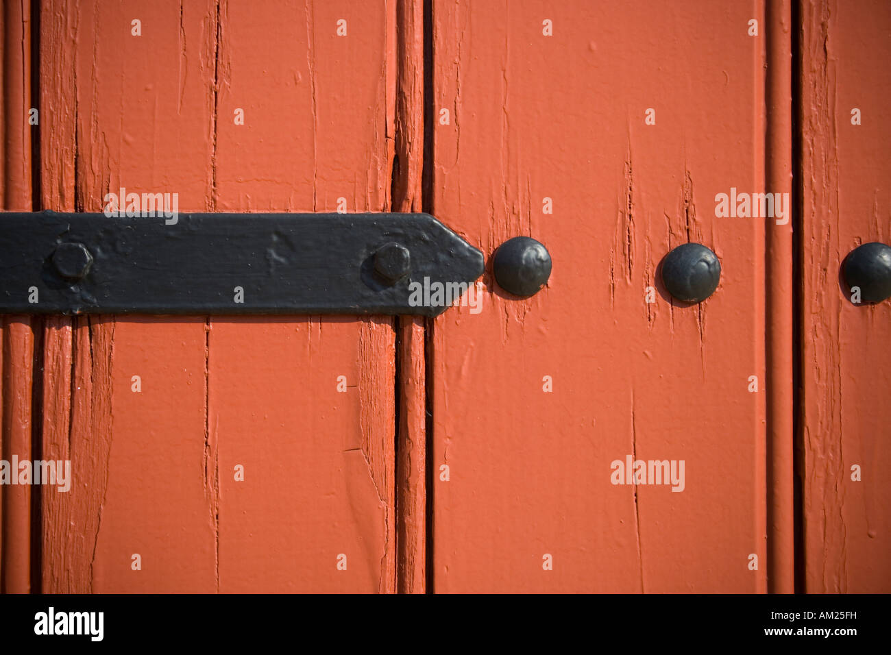 Red wooden door with nails and hatchet, background Stock Photo - Alamy