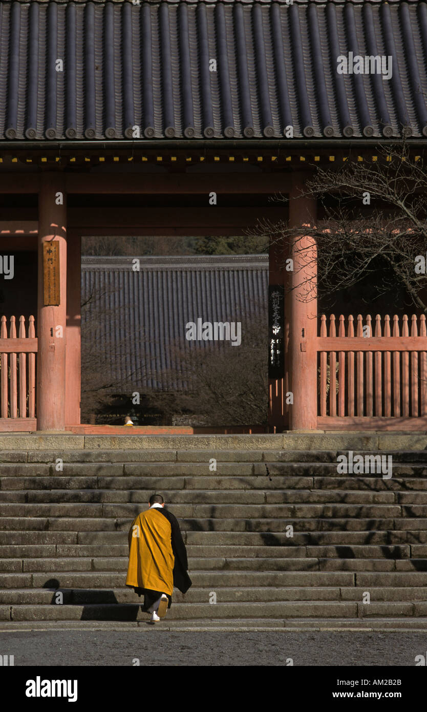 Buddhist priest walking up the temple steps Kinkaku ji temple Kyoto ...