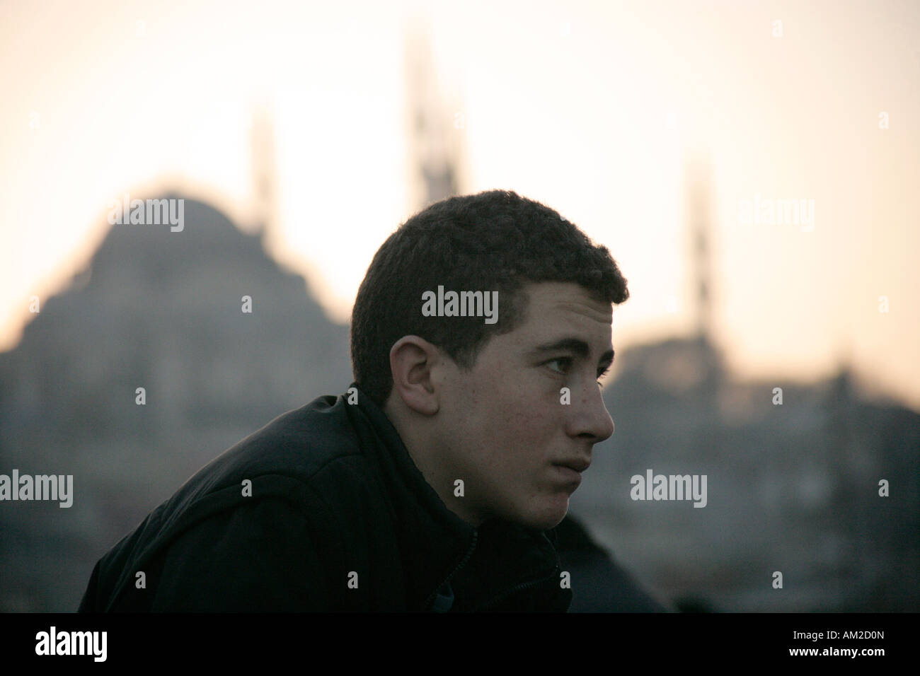 Young man with the Suleymaniye Mosque behind, Istanbul, Turkey Stock ...