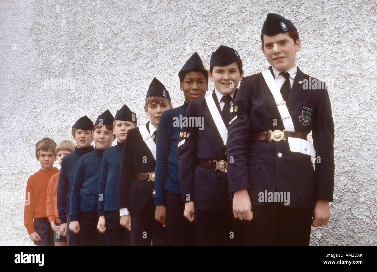 A line up of young boys in various uniforms Stock Photo - Alamy