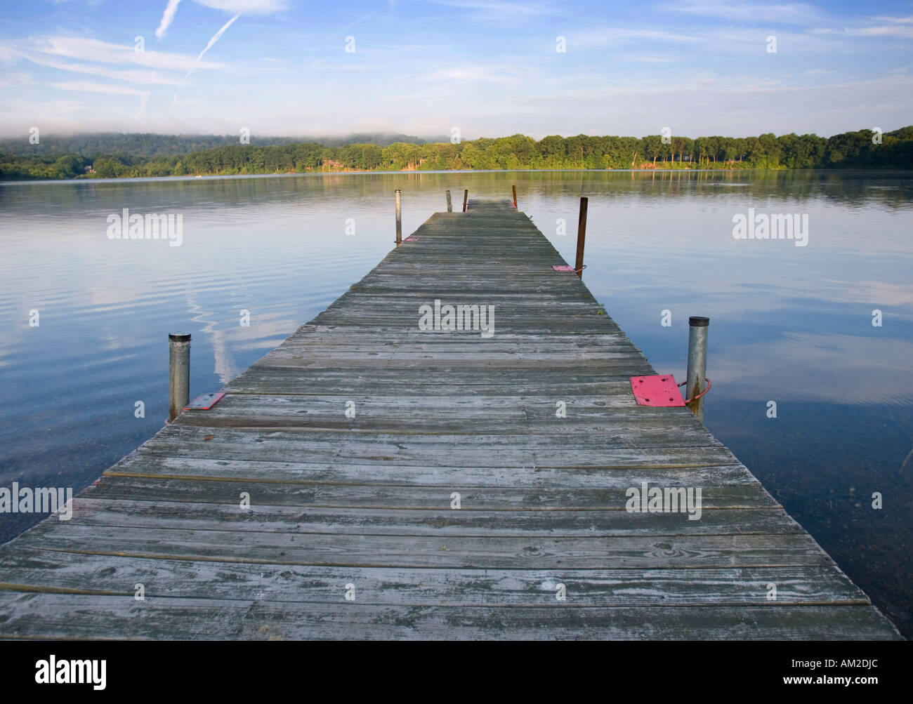 Pier leading into a lake Stock Photo - Alamy