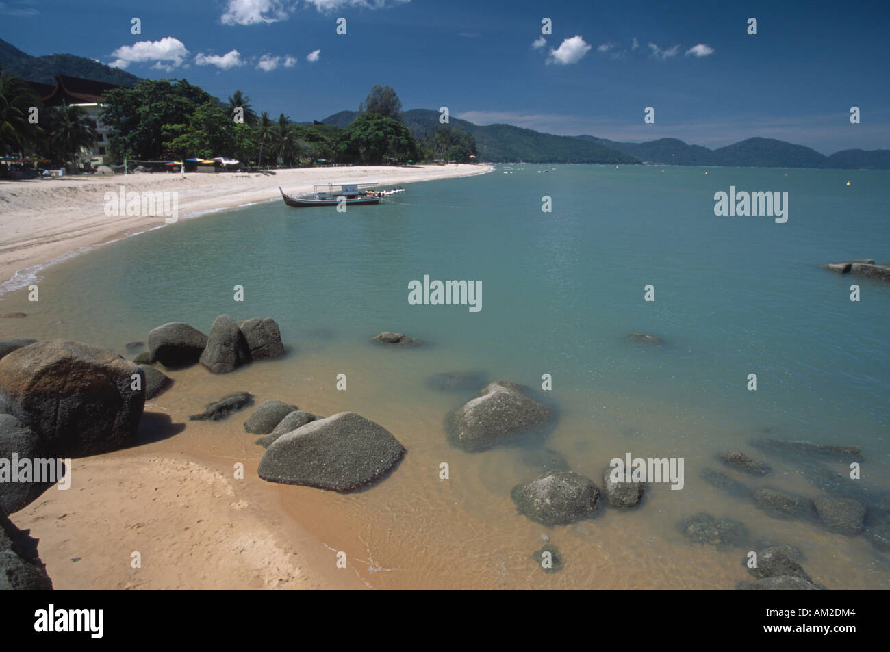MALAYSIA Penang Batu Ferringhi Beach View over rocks and bay of ...