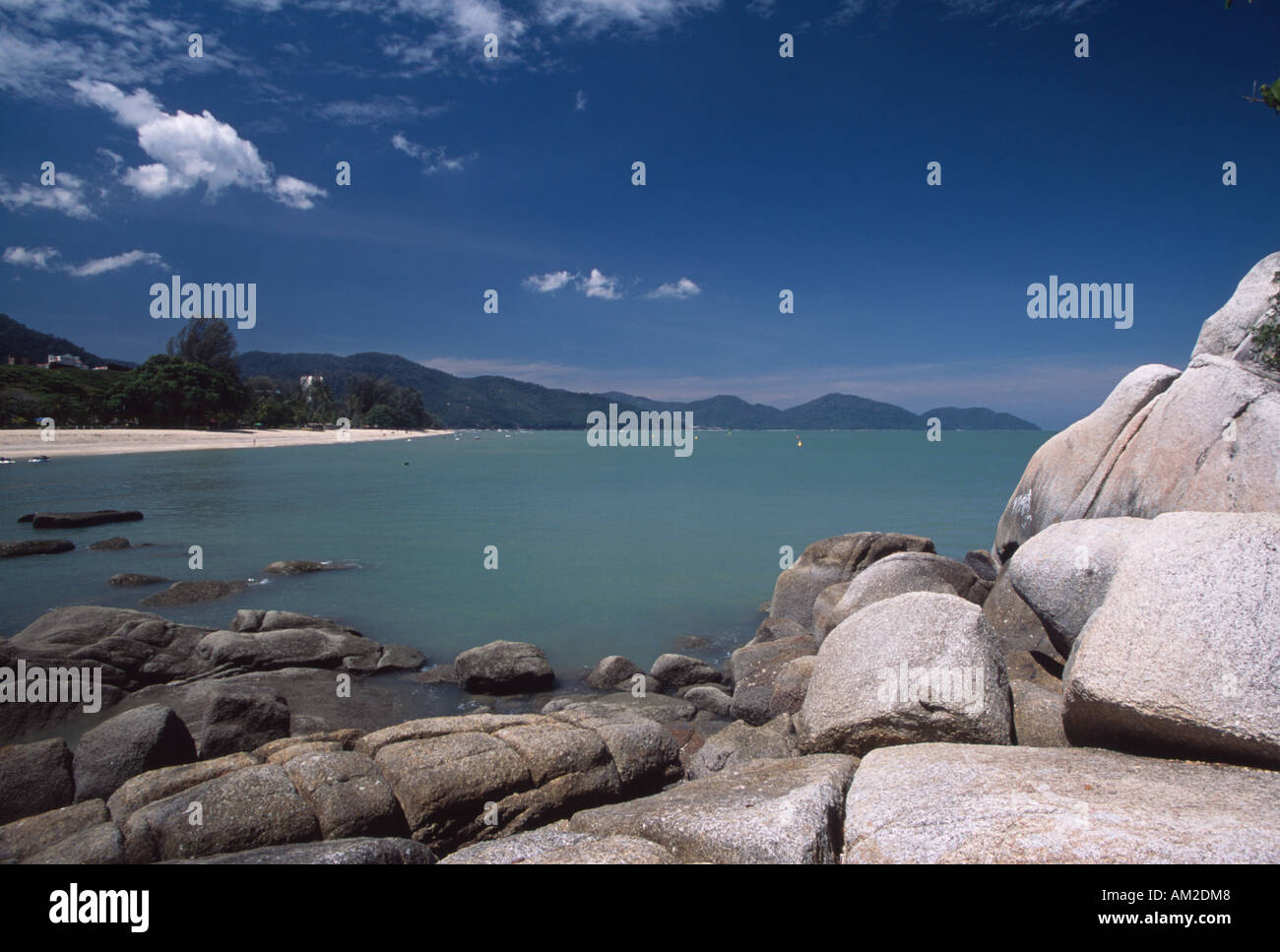 MALAYSIA Penang Batu Ferringhi Beach View over rocks and bay of ...