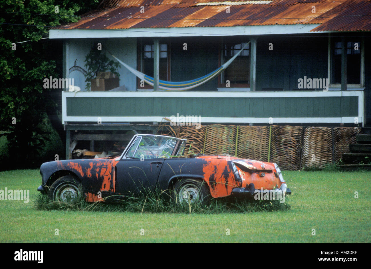 A junk sports car decaying in Hawaii Stock Photo - Alamy