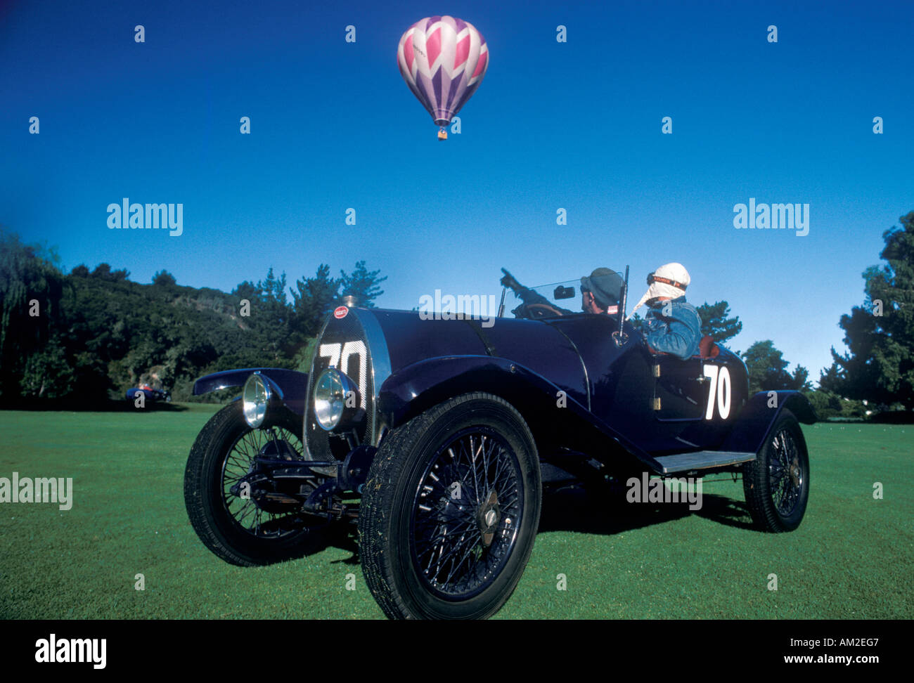 A navy blue Bugatti car and hot air balloon at the 35th Annual Concours ...