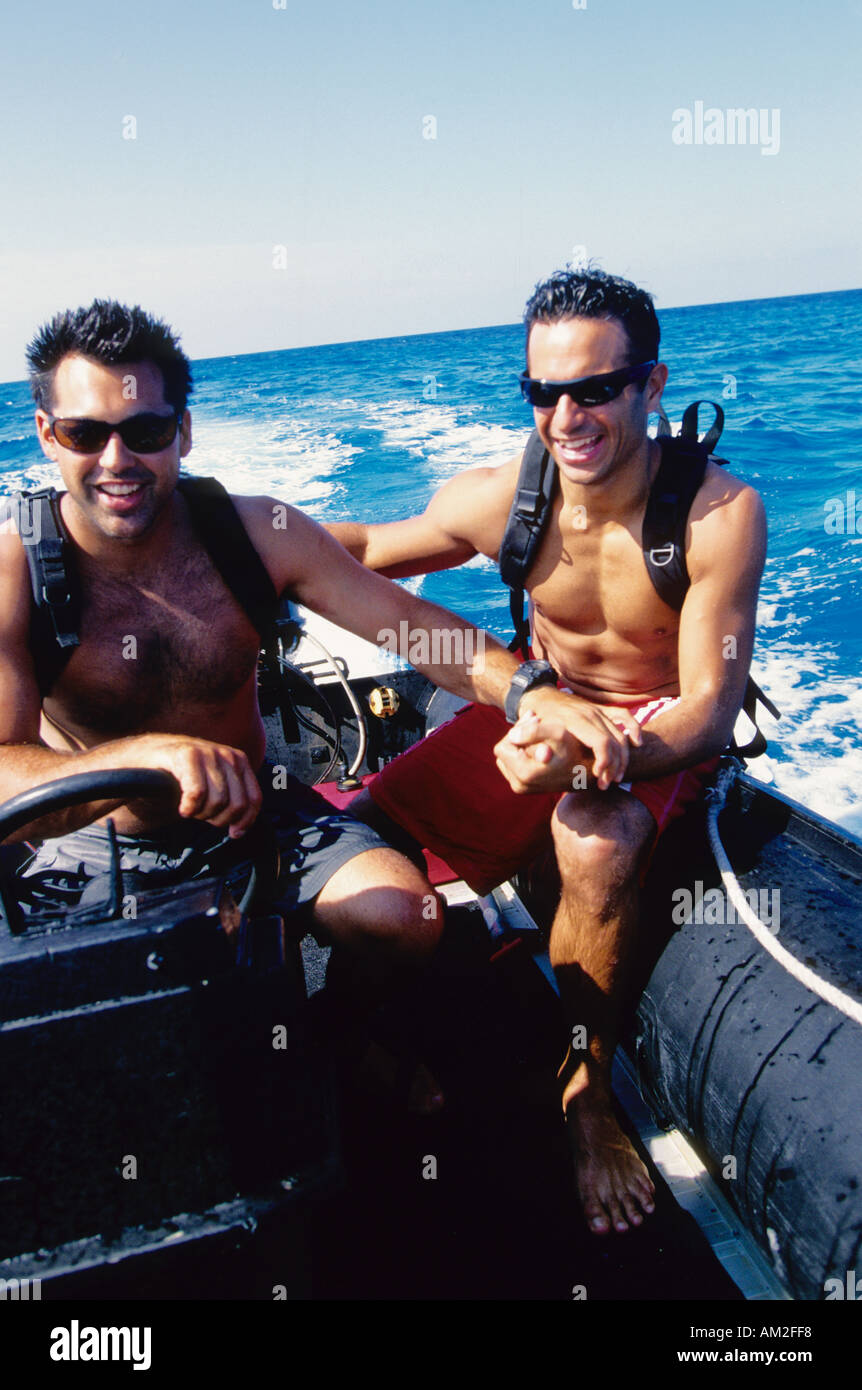 Men boating in an inflatable boat in Hawaii Stock Photo - Alamy