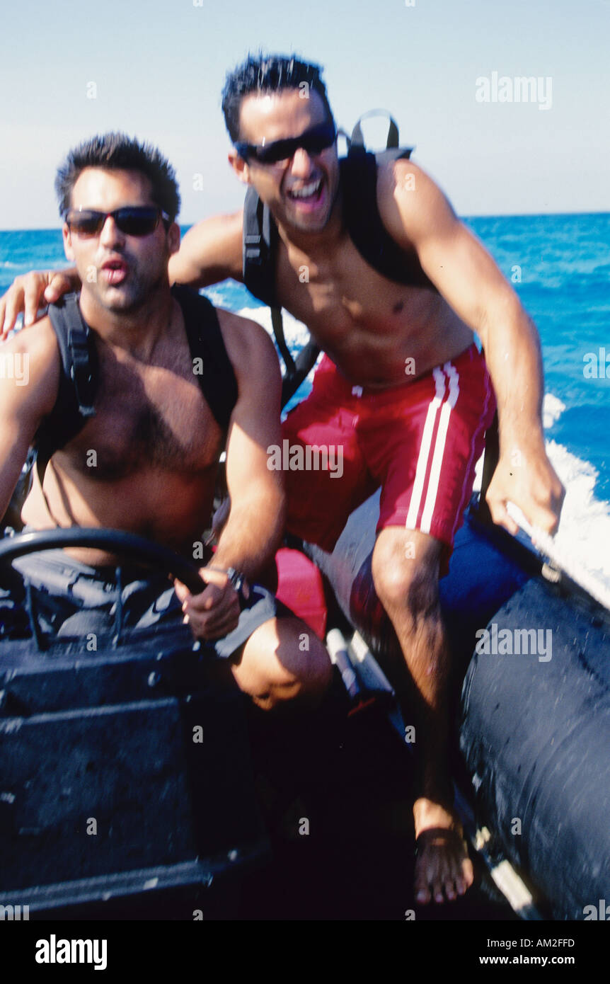 Men boating in an inflatable boat in Hawaii Stock Photo - Alamy