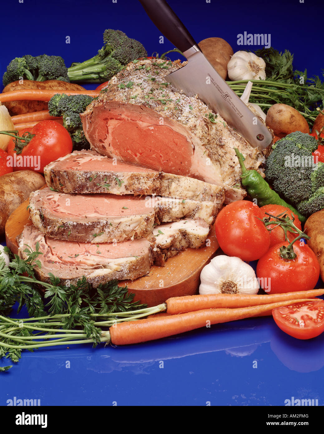 side of beef slices carrot tomato tomatoe brocolli garlic butcher knife ...