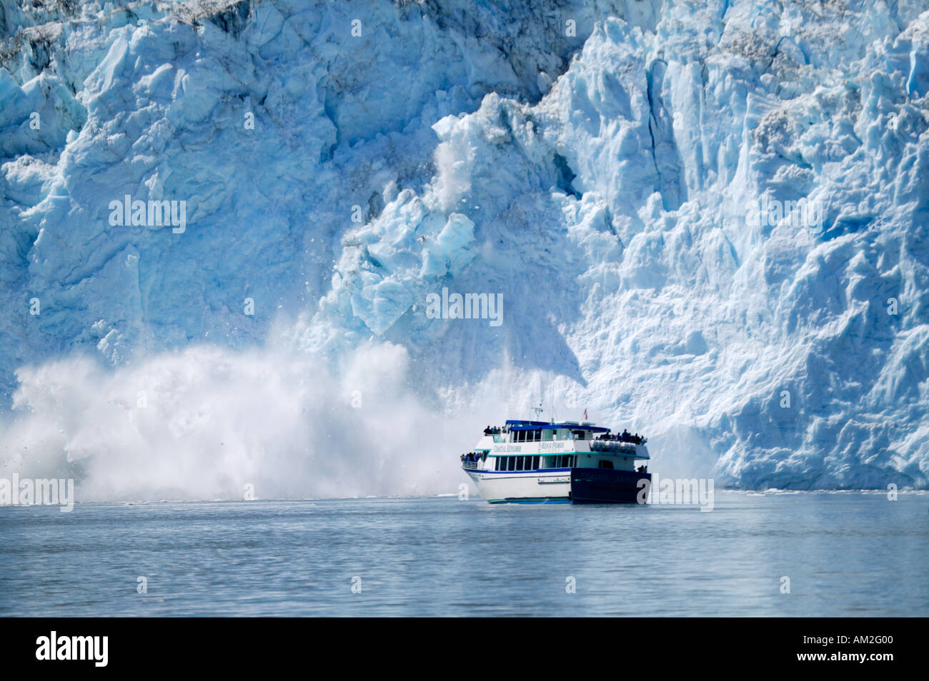 The Kenai Fjords Tours boat Coastal Explorer in front of calving ice ...