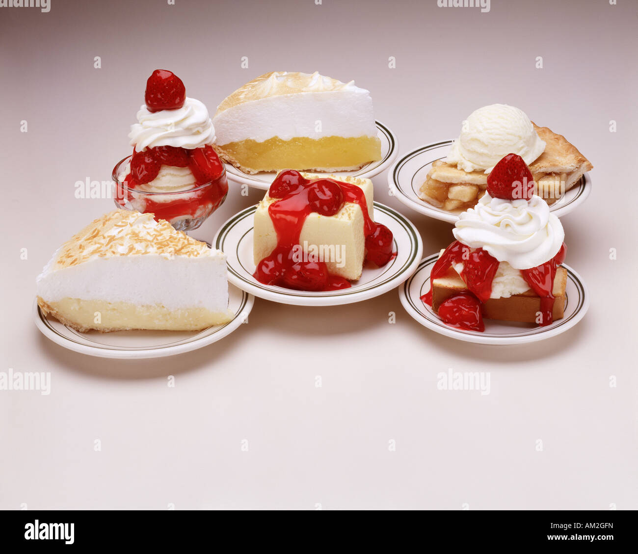 assortment desserts lemon coconut meringue pie strawberry short cake ...