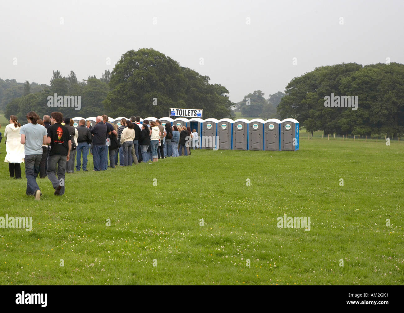 Toilet queue at outdoors pop concert Stock Photo - Alamy