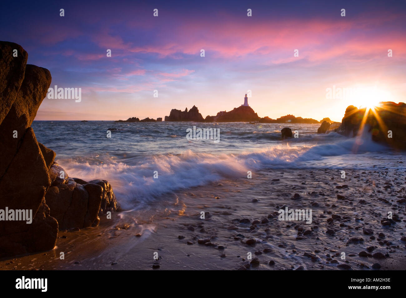 Channel Islands Jersey Corbiere Lighthouse at sunset Stock Photo - Alamy