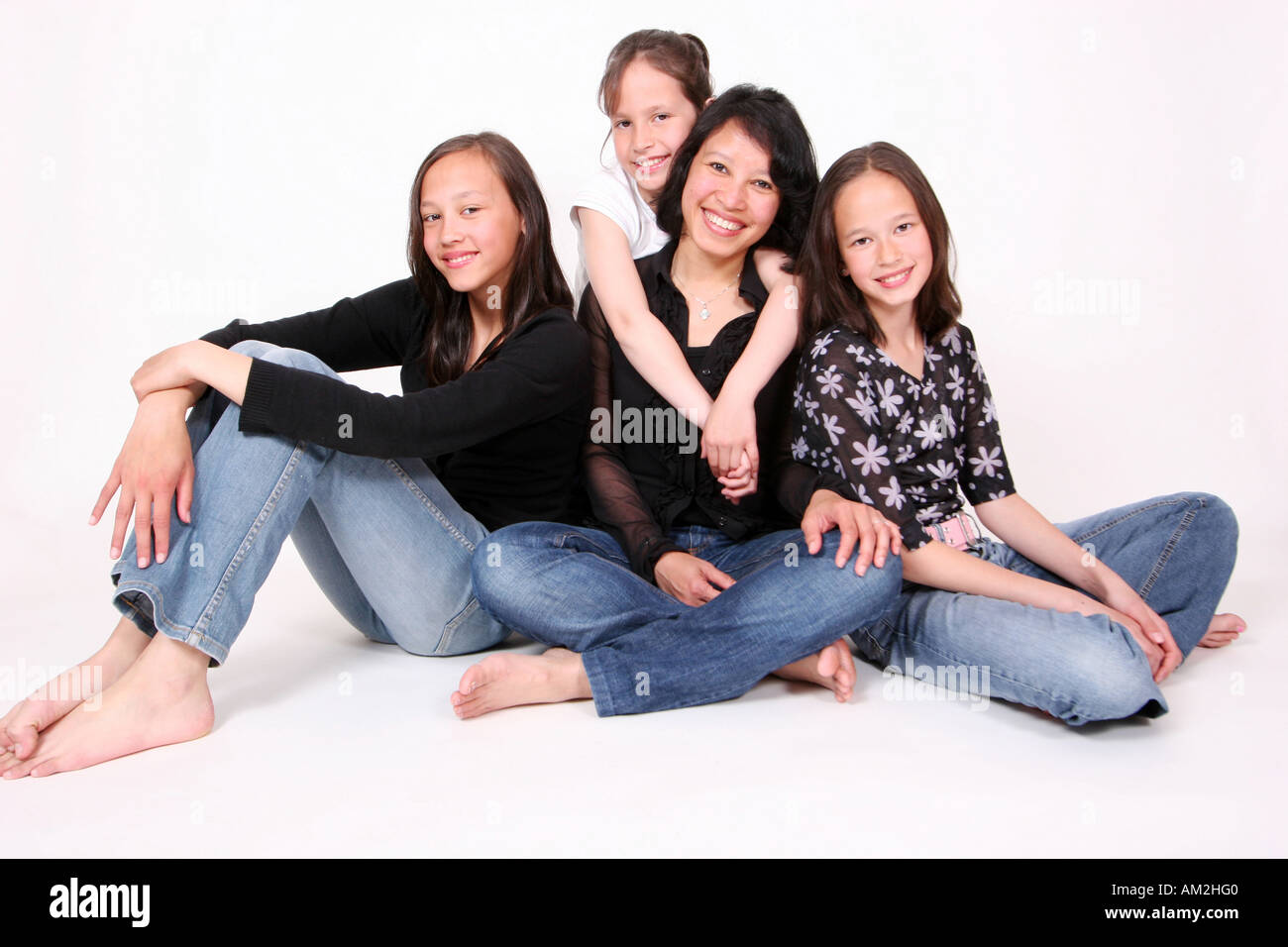 family portrait mother with three daughters Stock Photo - Alamy