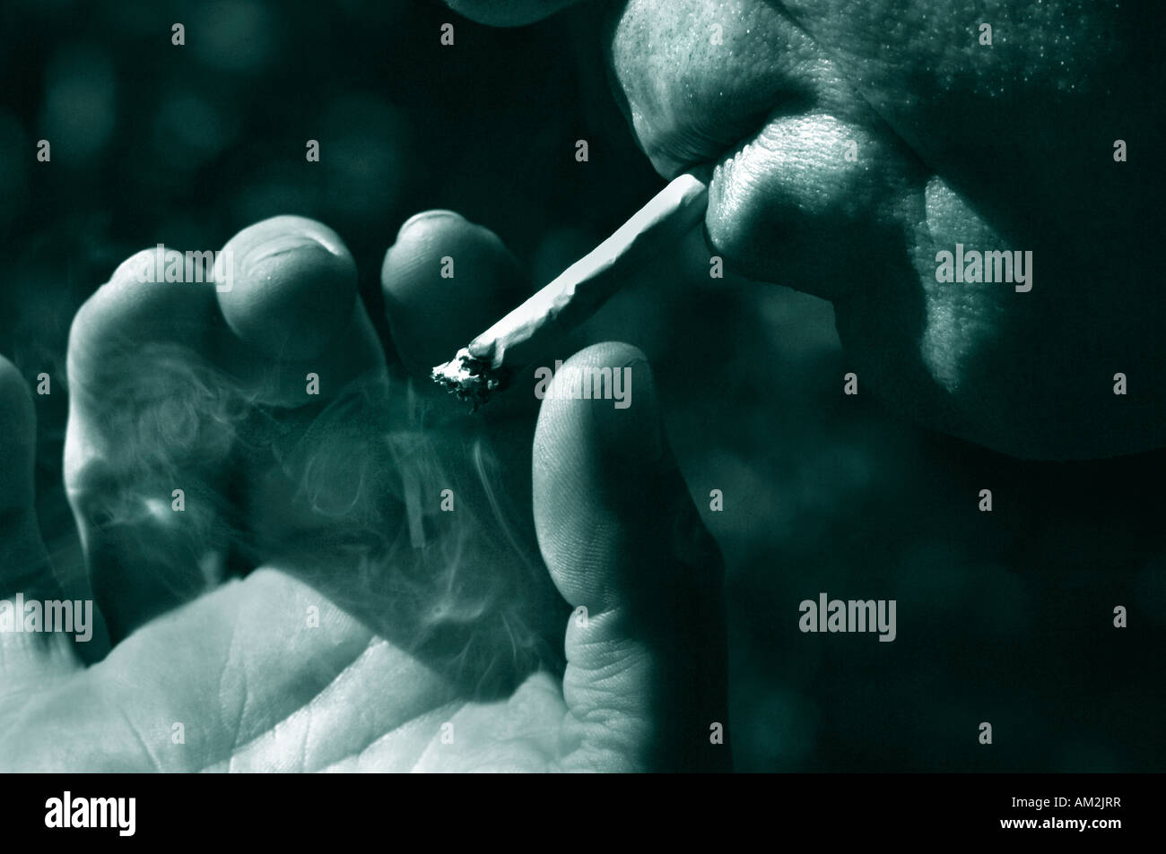 A Man Smoking An Unfiltered Rollup Cigarette Stock Photo - Alamy