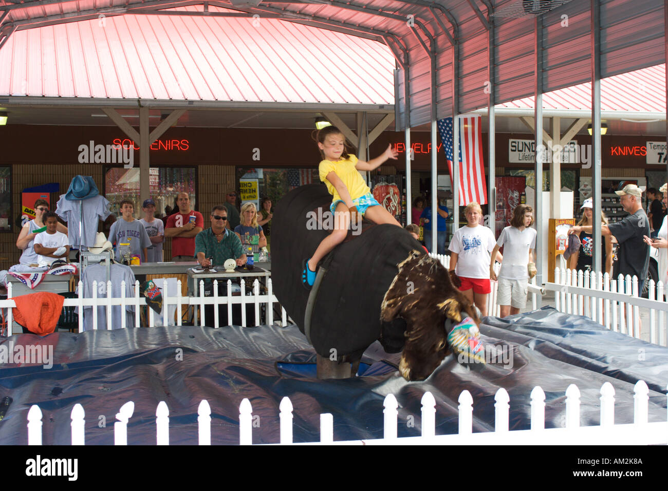 Girl riding mechanical bull hi-res stock photography and images - Alamy
