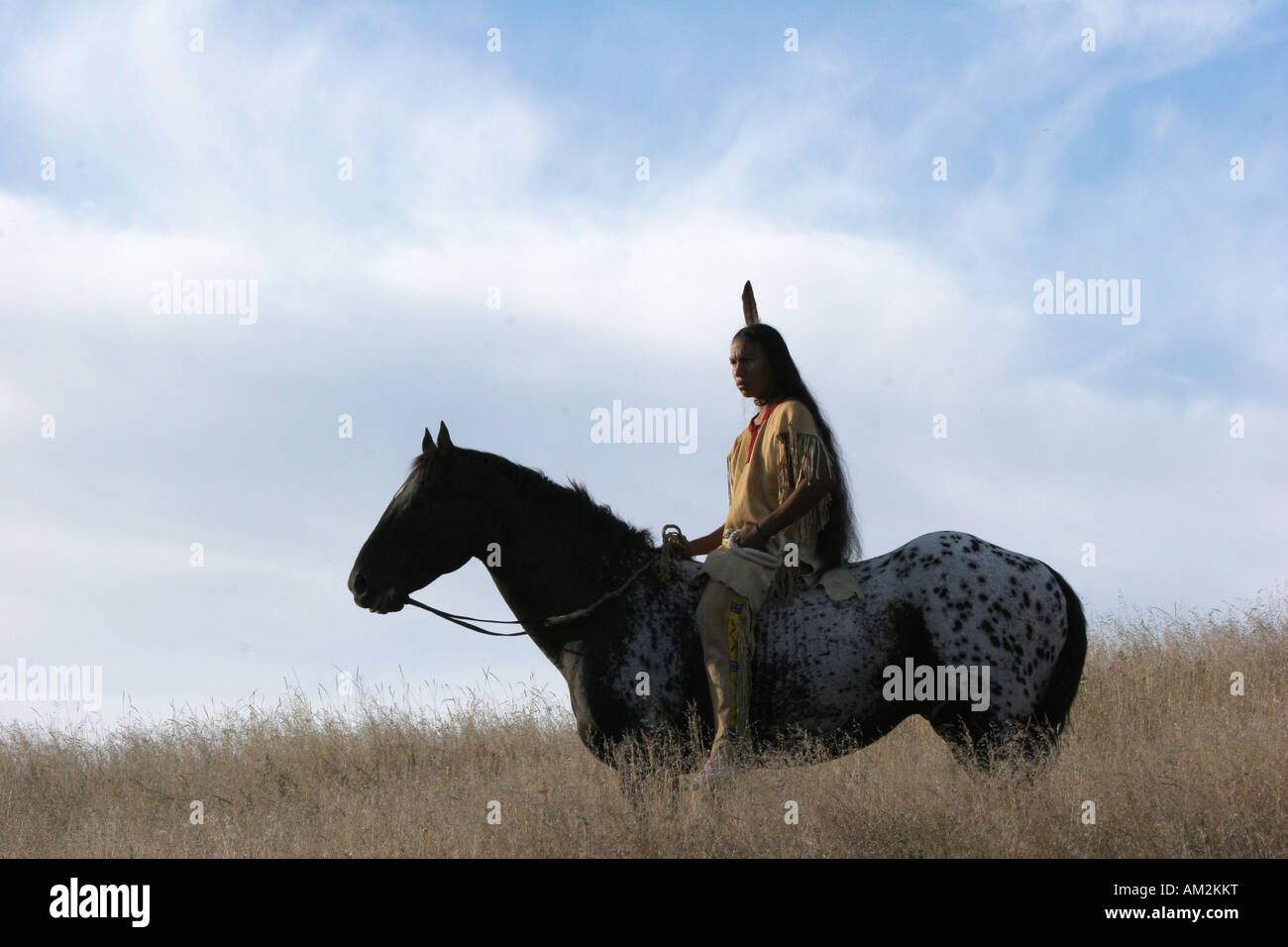 A young Native American Indain horseback riding a horse bareback Stock ...