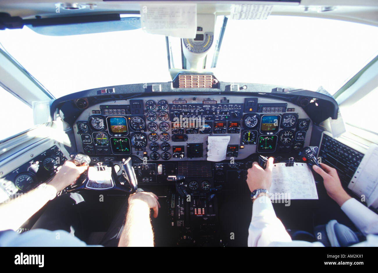 The cockpit and the pilots in a commuter airplane Stock Photo - Alamy