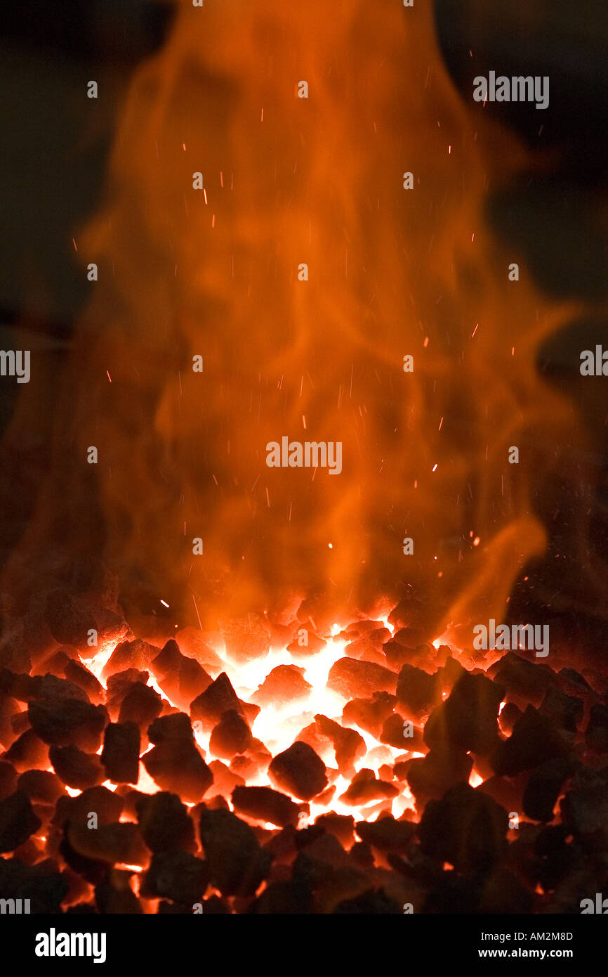 Blacksmith. Smithy furnace with white hot fire, glowing embers and ...