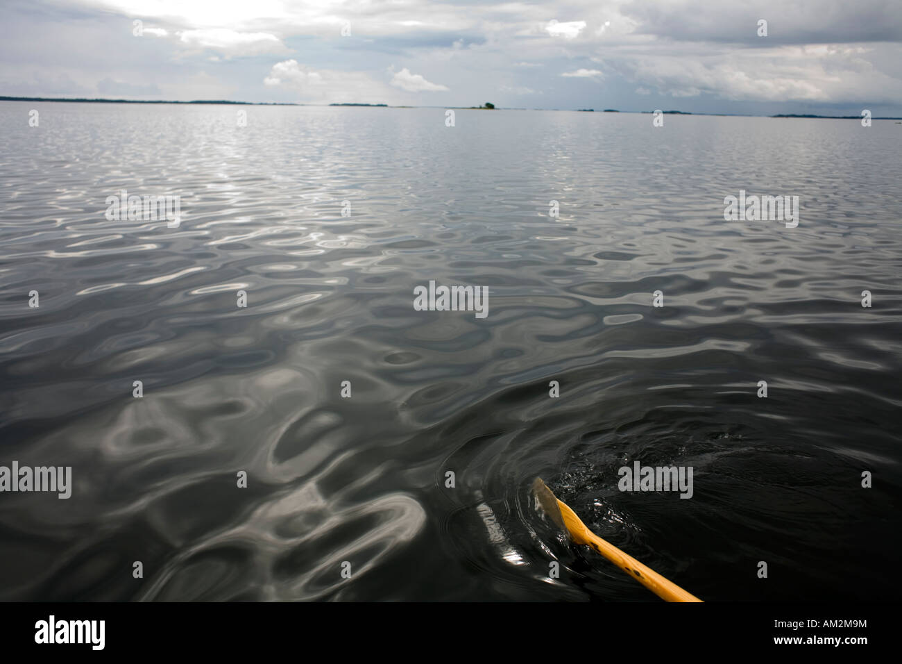 Oar in the water, from a fishing boat, floating in the Baltic Sea in ...