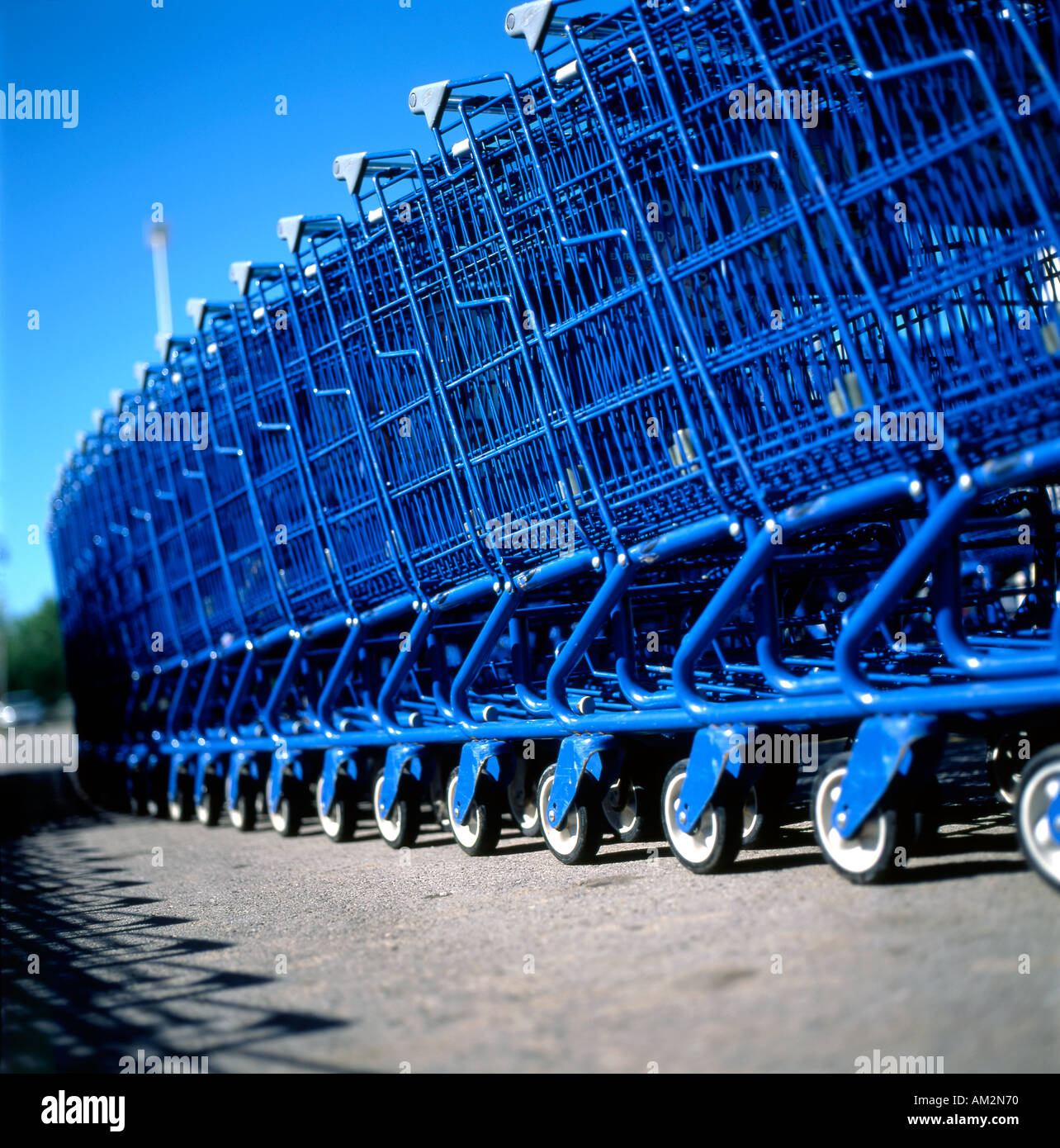 Blue interconnecting Walmart shopping trollies carts outside the store ...