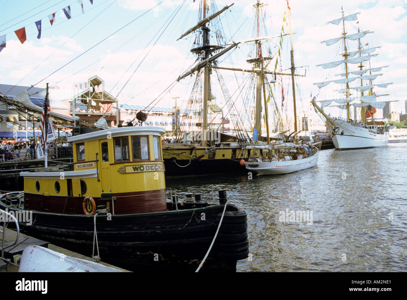 Tall Ships harbored in New York with tugboat in fore ground Stock Photo ...