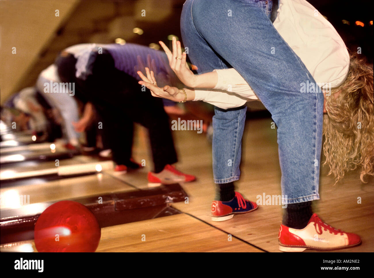 Bowlers do it differently backward upside down Stock Photo - Alamy