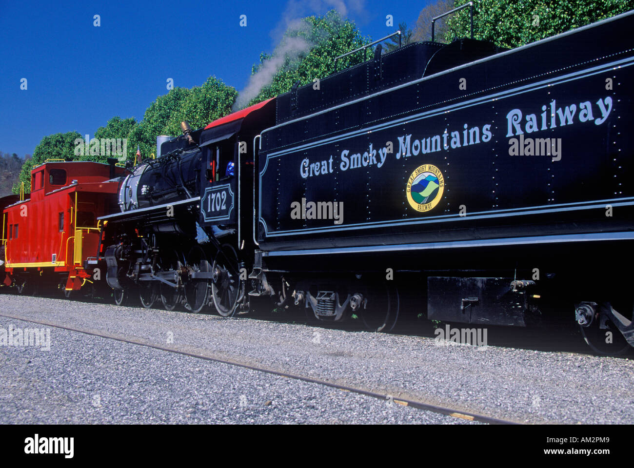 A steam engine traveling on the Great Smokey Mountain Railway in ...