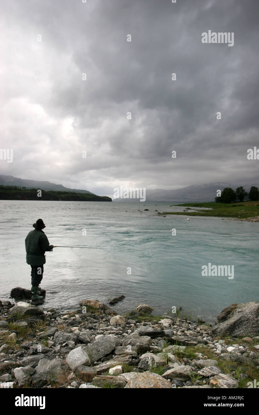 guy doing fishing wide vertical angle Stock Photo - Alamy