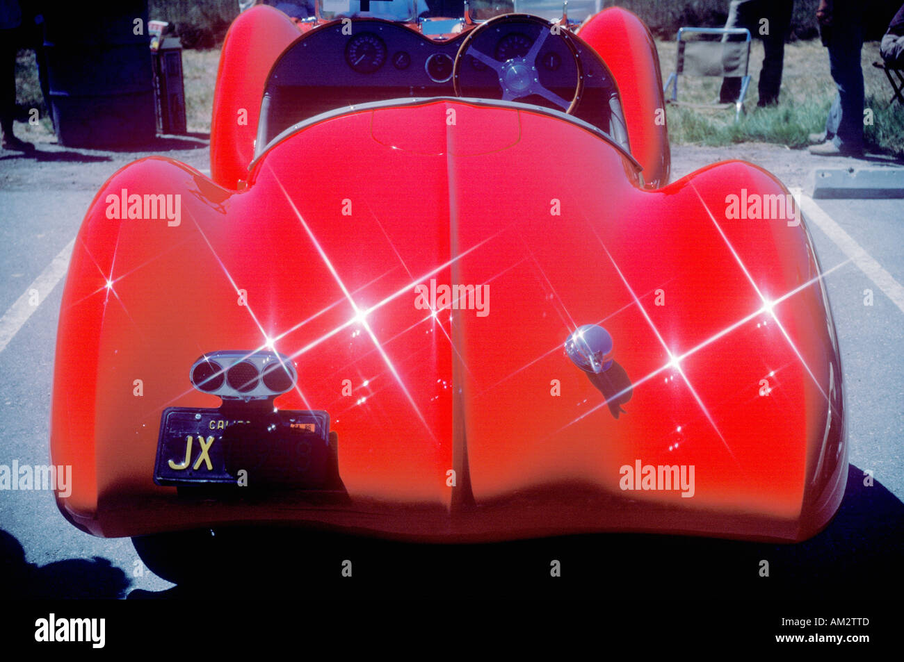 An Alfa Romeo Milano red car shown at the 35th Concours D Elegance Show ...