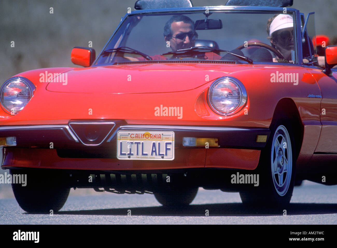 An Alfa Romeo Milano red car shown at the 35th Concours D Elegance Show ...