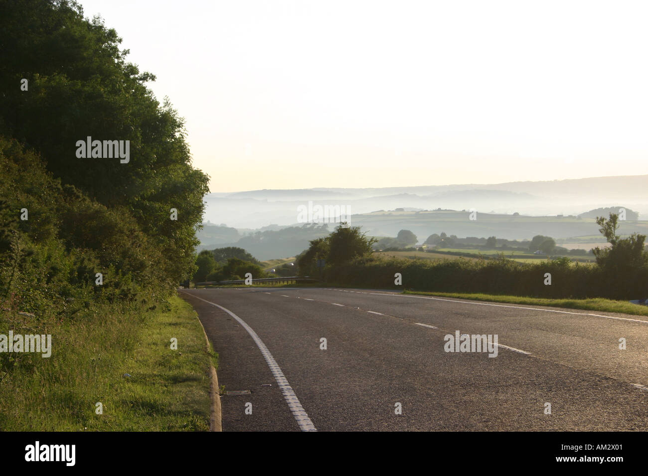 Mist rolling in across the hills in Dorset, England Stock Photo - Alamy