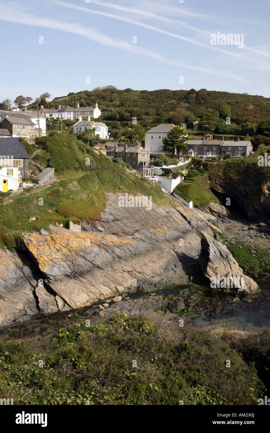 Cottages nestle on the hillside in the small fishing village of Portloe ...