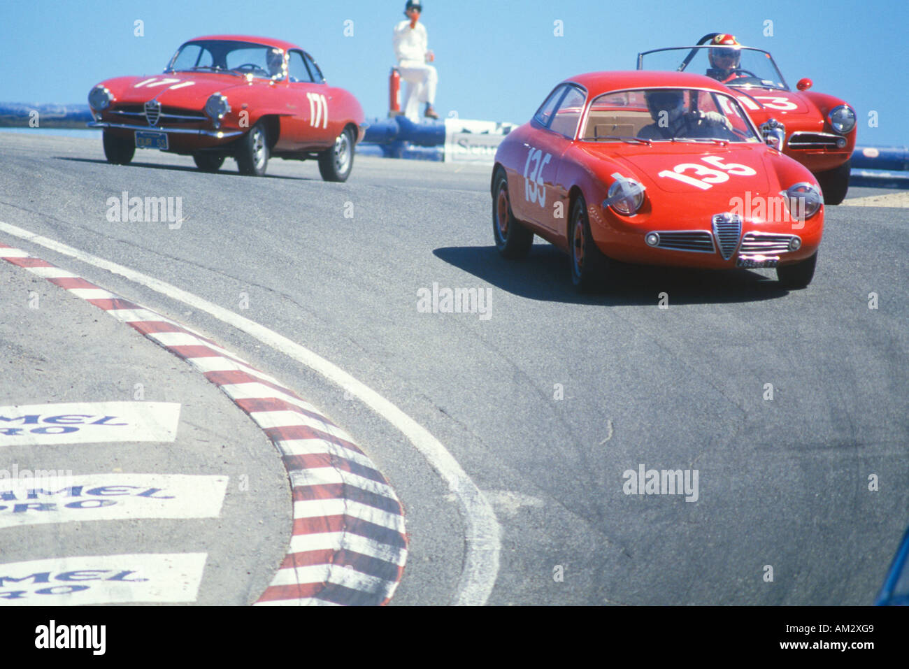 Vintage racecars speed along the track during the Laguna Seca race in ...