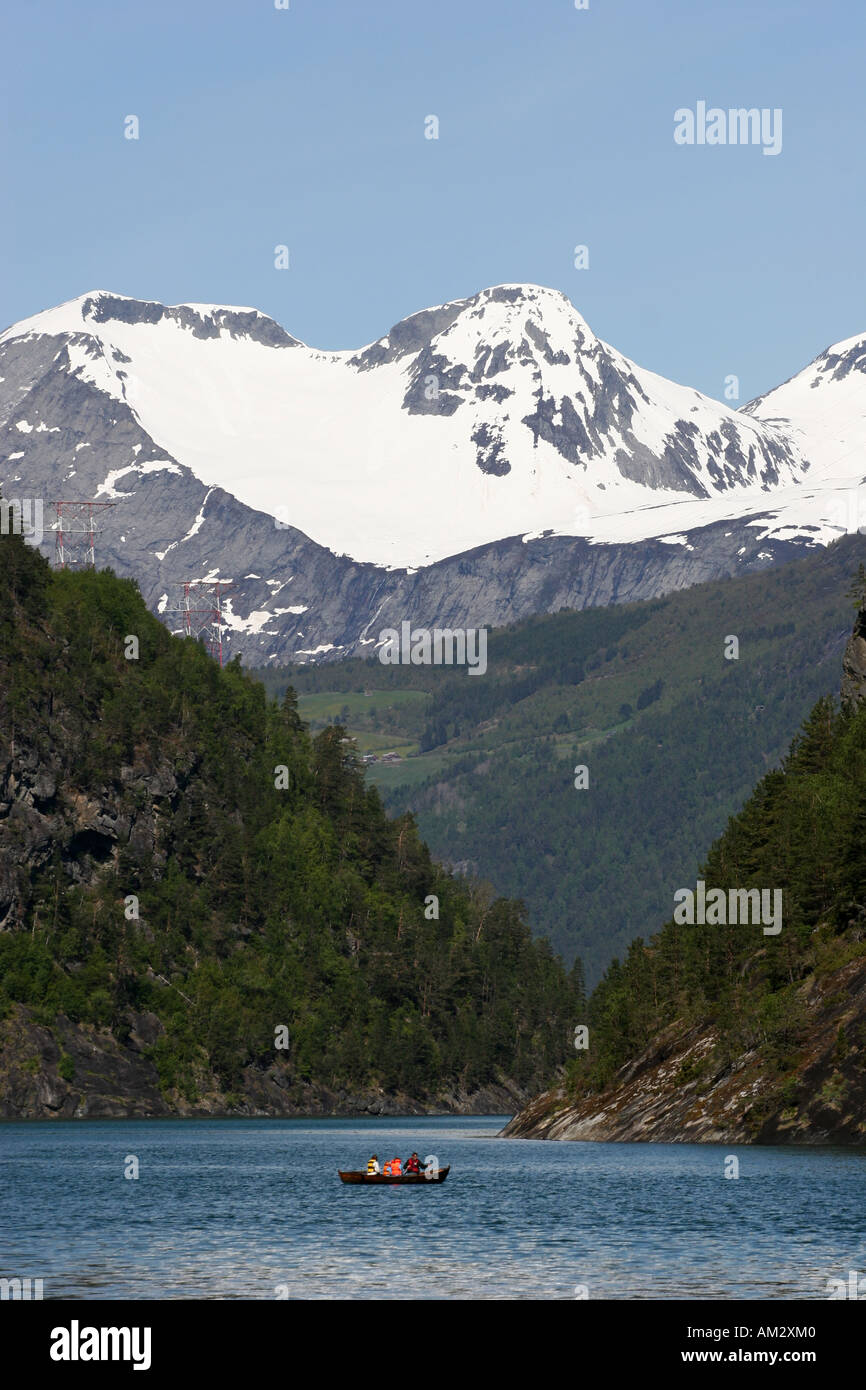 boat and snowy peak mountain at the background Stock Photo - Alamy