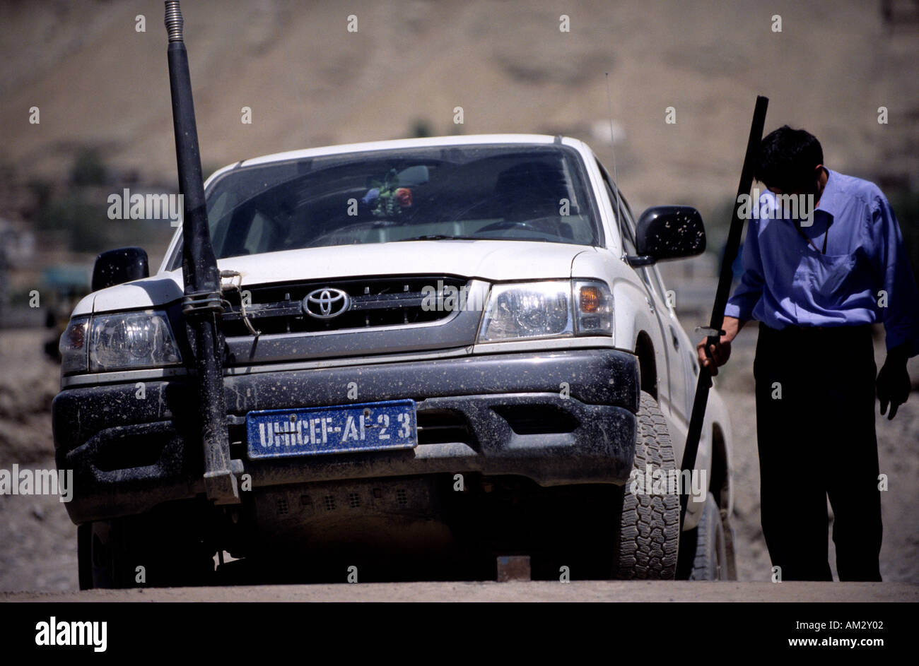 UN VEHICLE SECURITY UNFPA COMPOUND 27 July 2005 A security guard checks ...