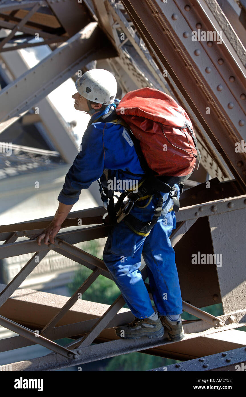 Construction workers on the Eiffel Tower Paris France Stock Photo - Alamy