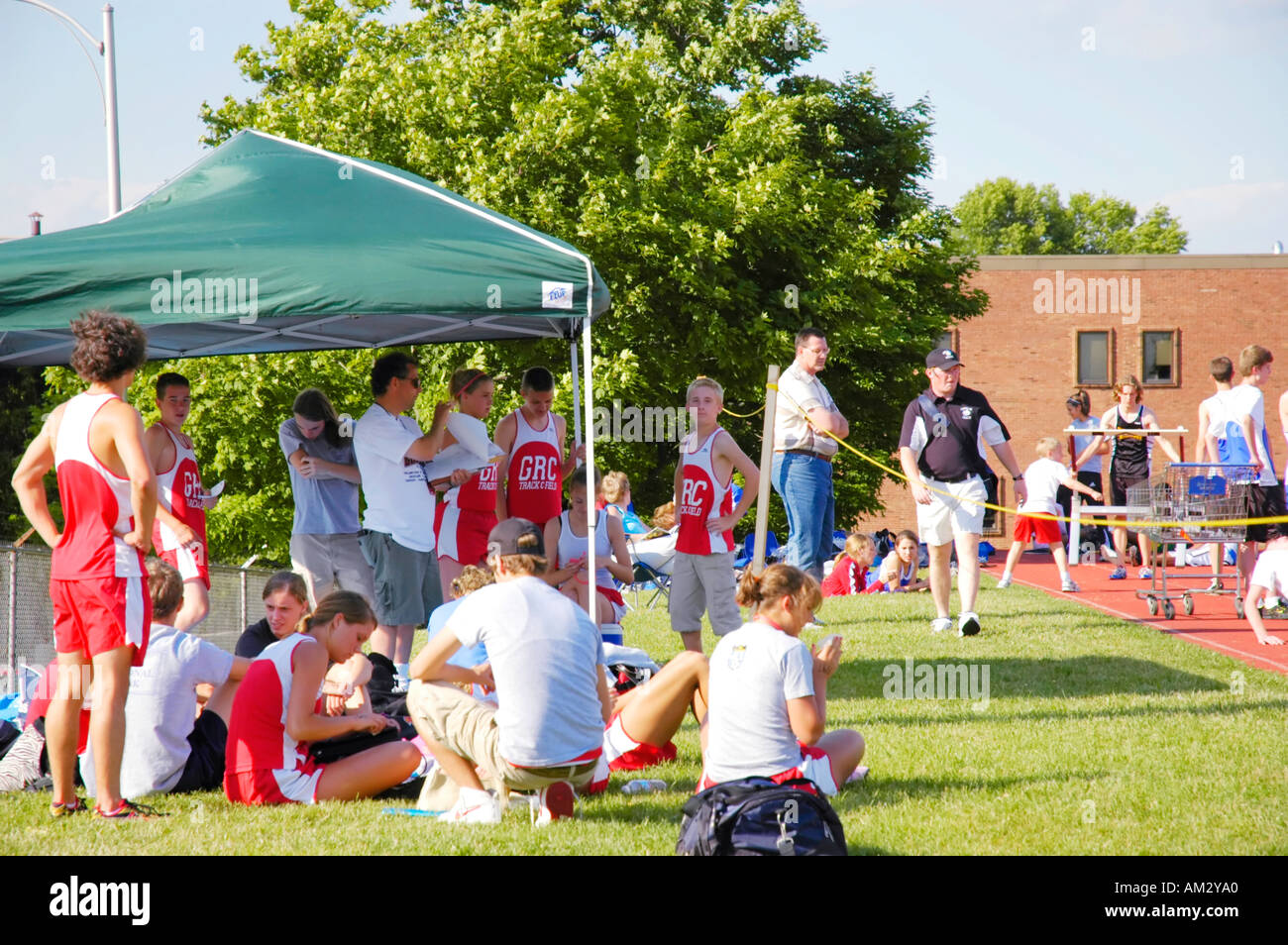 Teenage running team in their tent at a high school track and field ...