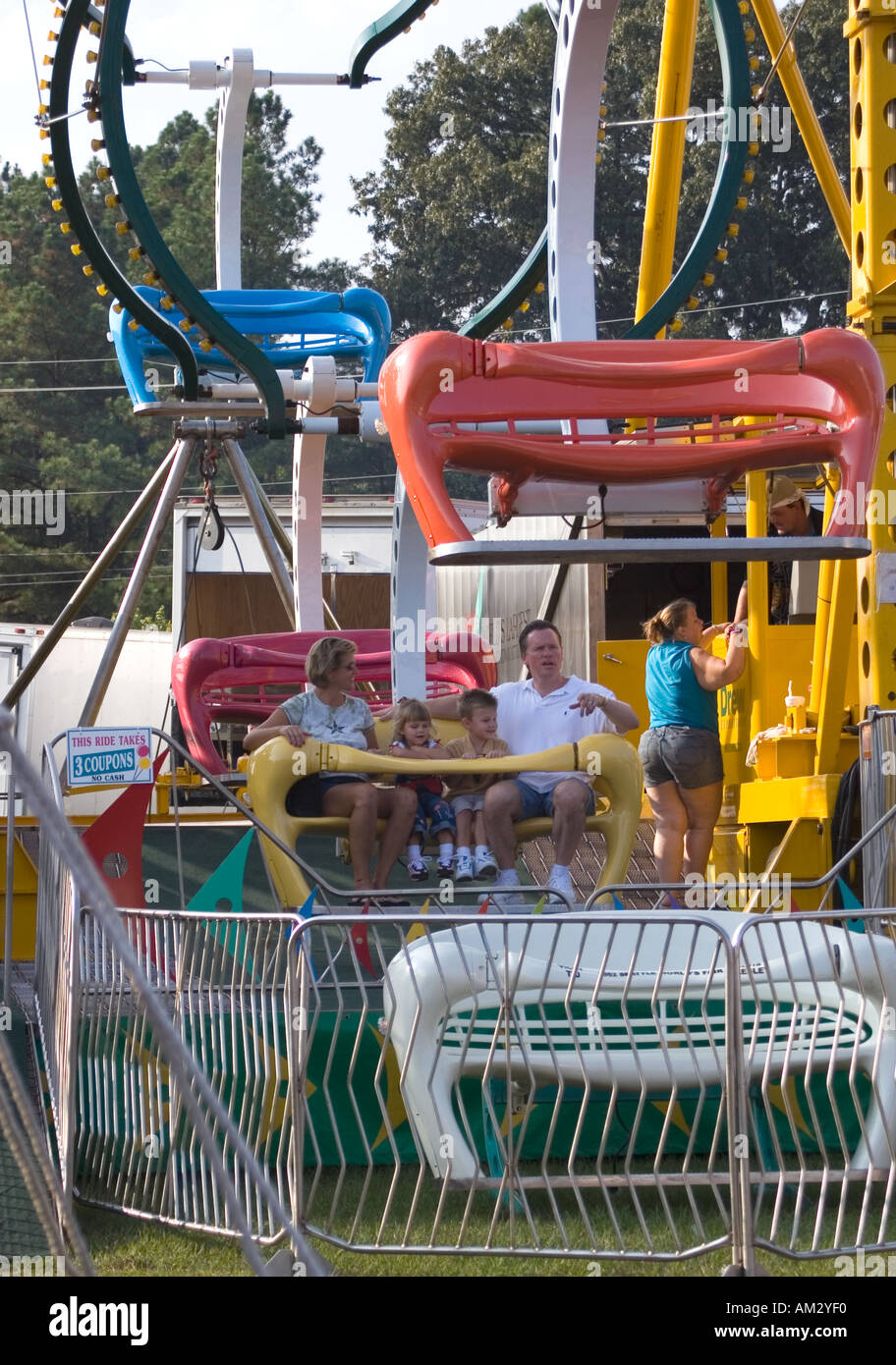 georgia county fair 18, family with children on rides Stock Photo - Alamy
